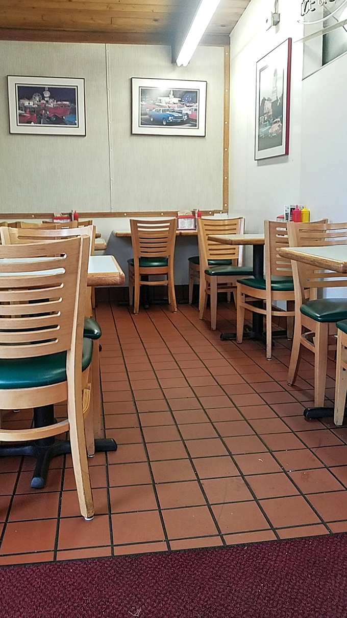 The dining area speaks volumes with its classic simplicity&mdash;wooden chairs, vintage photos, and decades of satisfied conversations.