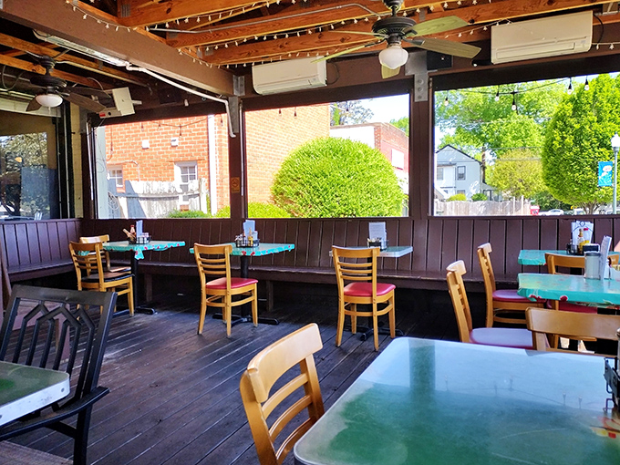The dining area feels like someone's particularly welcoming porch. String lights, wooden beams, and tables that have hosted countless conversations.