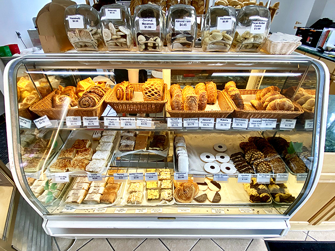 A pastry case that should come with a warning label: "May cause spontaneous joy and the urge to buy everything."