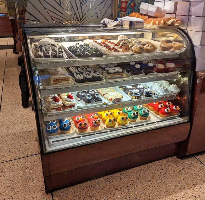 The dessert case&mdash;where willpower goes to die and happiness begins. Those colorful cupcakes with googly eyes are practically begging to be adopted.