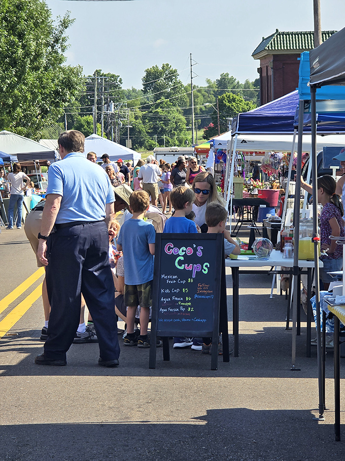 Farmers' market crowds proving that people still enjoy actual human interaction while buying their vegetables, refreshingly retro.