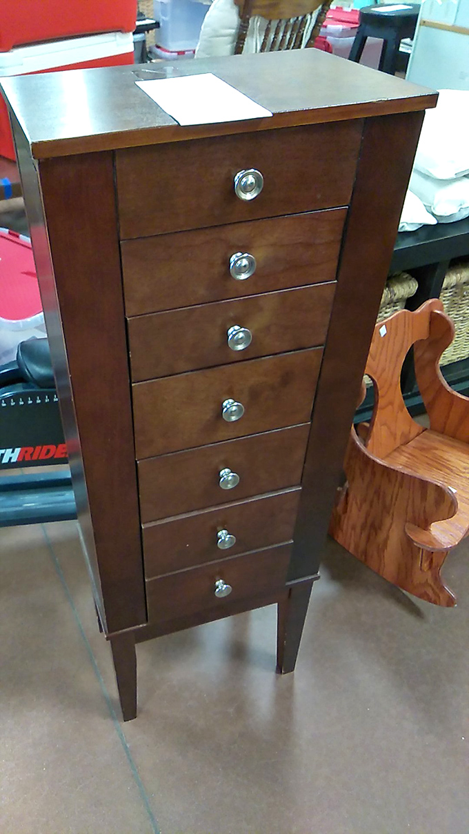This elegant wooden drawer unit stands tall and proud, like it once held the secrets of a Victorian novelist.