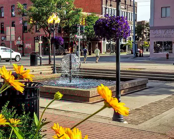 Summer transforms East Chisholm Street with hanging flower baskets that would make any botanical garden jealous.