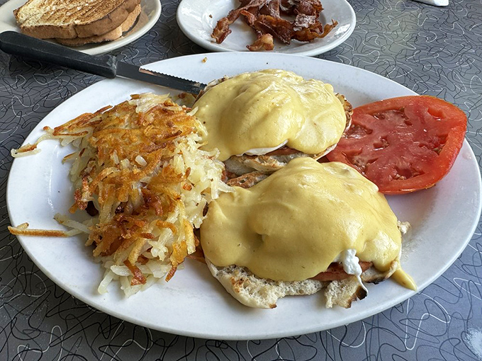 Eggs Benedict that makes you want to high-five the chef. Those hash browns are the unsung heroes of this breakfast masterpiece.