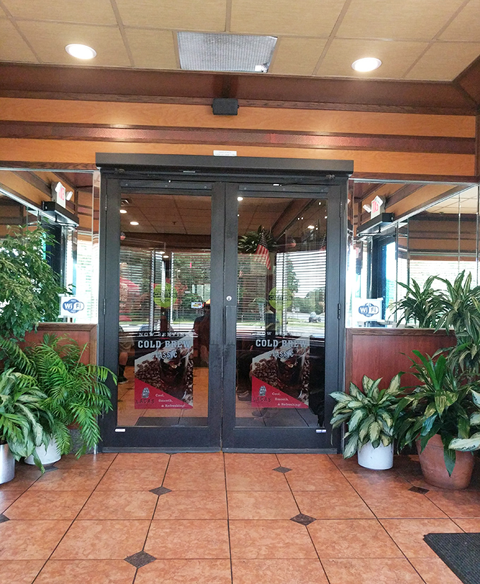 The entrance welcomes you with lush greenery and gleaming doors&mdash;like the pearly gates of comfort food heaven, minus the judgment about your appetite.