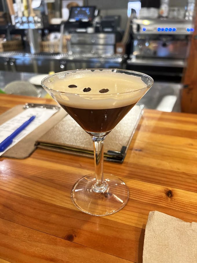 An espresso martini that bridges the gap between stimulant and relaxant. Three coffee beans float atop the frothy surface&mdash;one for health, wealth, and happiness.
