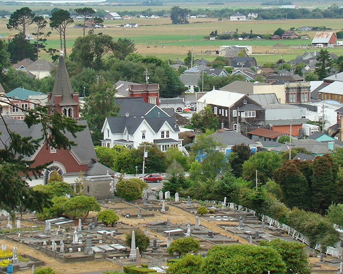 From this hillside cemetery, Ferndale spreads below like a diorama, with church spires punctuating a landscape that rolls toward dairy pastures.