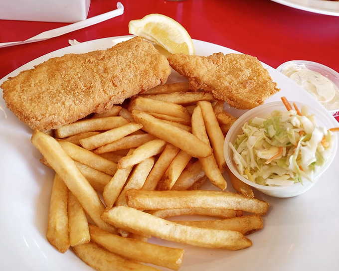 Fish and chips that would make the British jealous, with a golden crust that shatters at first bite and fries worthy of their own spotlight.