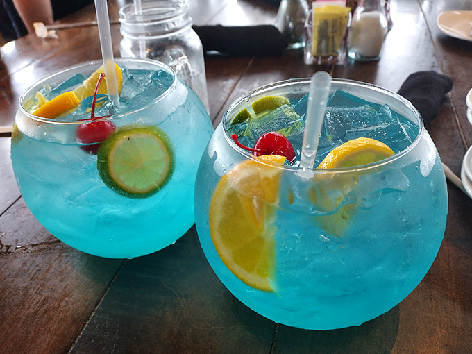 These fishbowl cocktails in electric blue aren't just drinks, they're vacation in a glass &ndash; complete with enough fruit to count as a vitamin supplement.