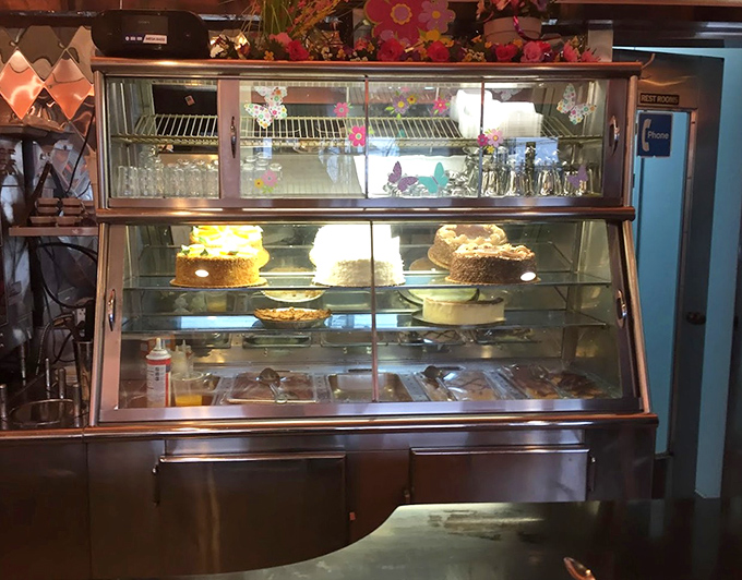 The dessert case&mdash;where willpower goes to die. Those cakes and pies aren't just desserts; they're edible monuments to American baking tradition.