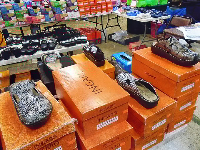 Shoe boxes stacked like a fashionista's dream. These aren't just footwear&mdash;they're future adventures waiting to be walked into at bargain prices.