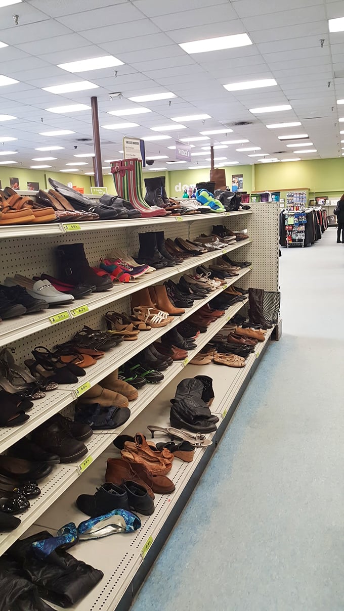 The footwear aisle: a podiatric history museum where barely-worn wedding shoes and gently-used hiking boots await their chance to walk new paths.
