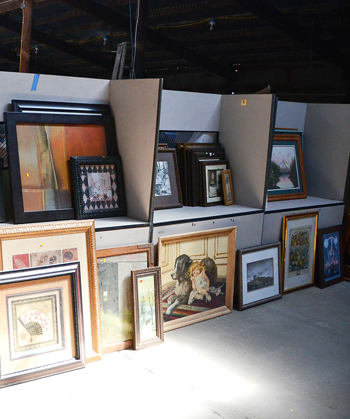 Wall art waiting for its forever home. That lone tree painting could be the conversation piece your living room desperately needs.