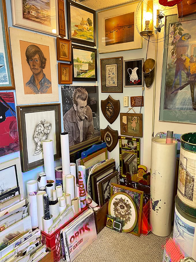 A wall where James Dean broods eternally alongside forgotten portraits and landscapes. Someone's memories, now available for purchase.