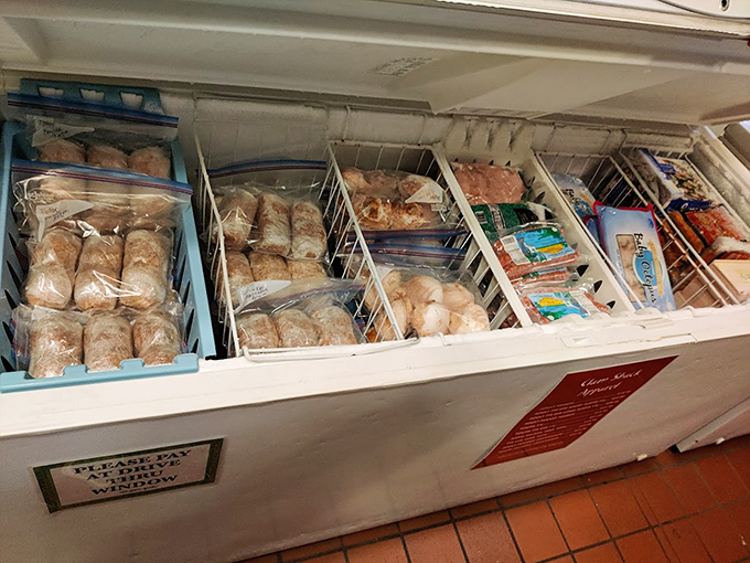 The freezer case reveals the market side of the operation, where seafood treasures await those brave enough to cook at home.