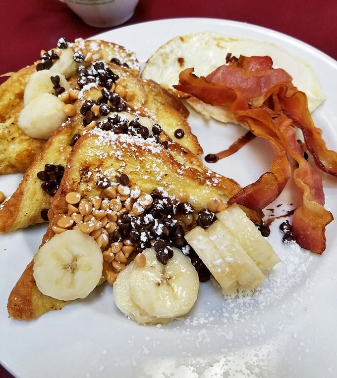 French toast that's dressed for success with bananas, chocolate chips, and enough powdered sugar to make your dentist wince approvingly.