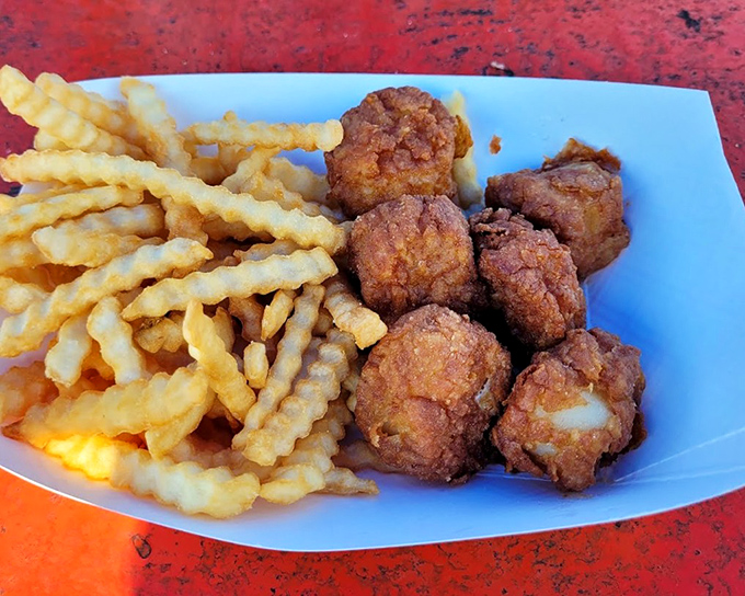 Fried scallops and crinkle-cut fries &ndash; the golden duo that makes diets disappear faster than the tide. Worth every calorie.
