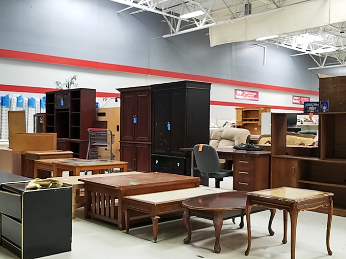 Furniture that spans decades sits in patient formation. That coffee table has seen everything from rotary phones to TikTok videos being filmed on its surface.