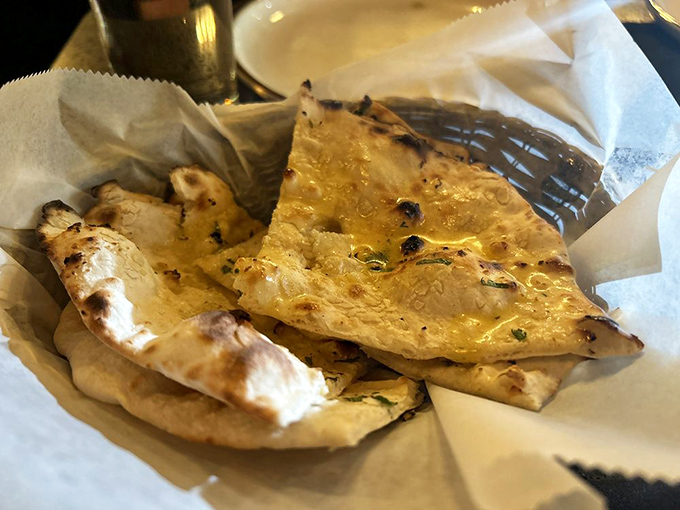 Garlic naan fresh from the tandoor, bubbled and beautiful as a work of art.