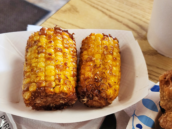 Grilled corn that's seen just enough flame to transform from simple vegetable to caramelized treasure. Summer on a plate, regardless of season.