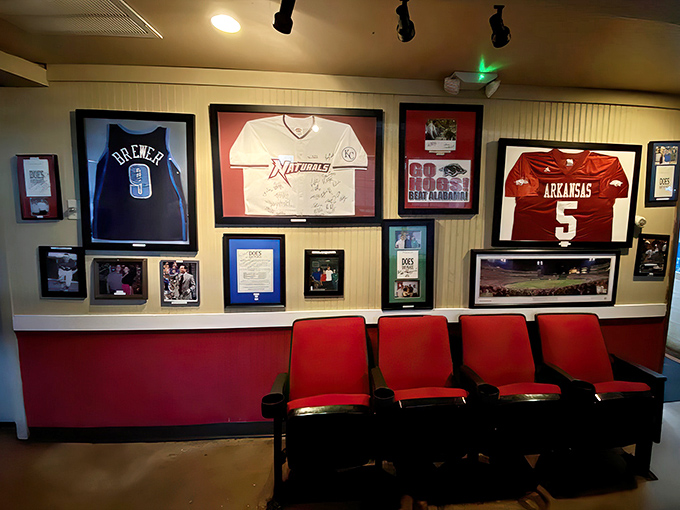 The Wall of Fame showcases Arkansas pride, where sports jerseys remind you that athletes need serious protein to perform—just like you do tonight.