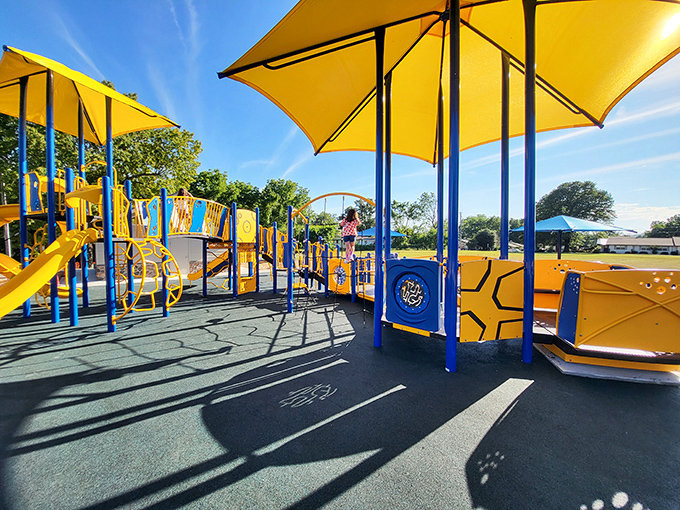 Hickory Park's playground equipment gleams in the sunshine, ready for the laughter of children whose parents once played here too.