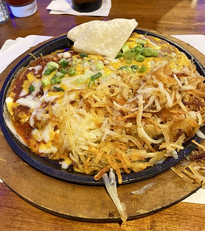 Huevos rancheros swimming in sauce like they're on a spicy vacation south of the border.