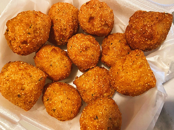 Hush puppies so perfectly golden and round, they're practically begging you to dip them into whatever sauce is within arm's reach.