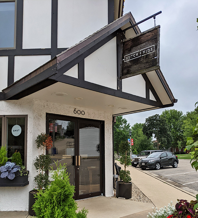 Hutch and Hide's storefront embodies the town's commitment to Swiss-inspired design details. Even modern businesses honor the architectural heritage.
