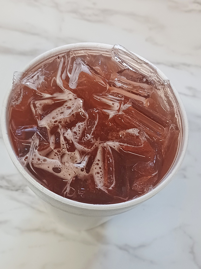 Another view of that sweet tea, catching the light like liquid amber&mdash;the unofficial wine pairing for everything on Tori's menu.