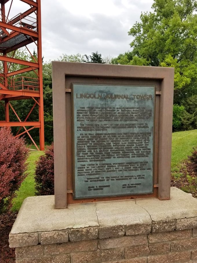The Lincoln Journal Tower plaque stands sentinel beside the observation tower, a reminder of those who helped preserve this natural treasure.