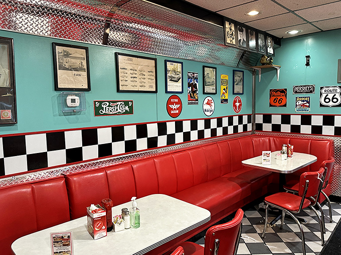 The turquoise walls and checkered trim create the perfect backdrop for red vinyl booths&mdash;a Norman Rockwell painting come to life.