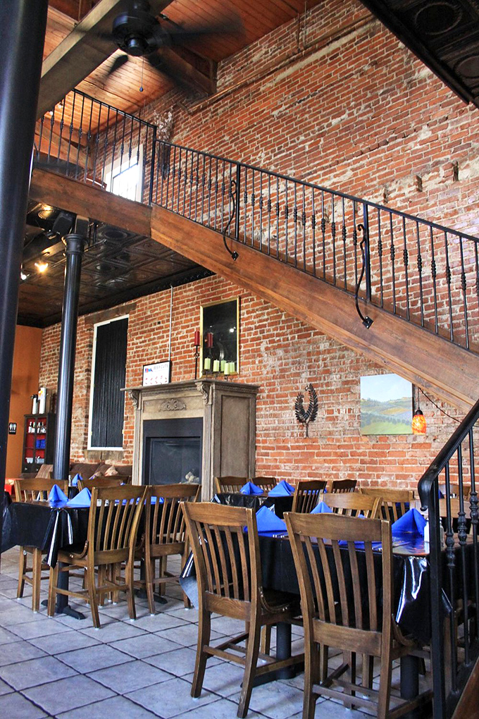The mezzanine level adds architectural drama to your dining experience, while those brick walls have likely heard more satisfied "mmms" than a chocolate factory.