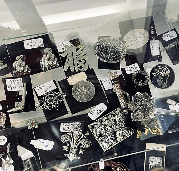 Jewelry treasures under glass—where someone else's "just not me anymore" becomes your signature piece.
