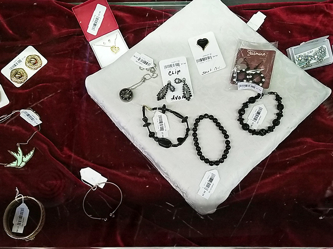 Jewelry treasures under glass&mdash;each tagged piece represents both a bargain and the chance to own something with character and history.