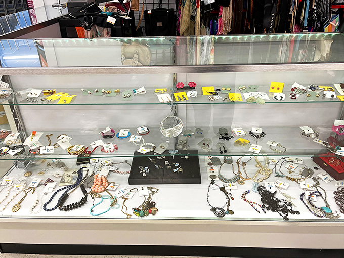 Behind glass, jewelry sparkles with second-chance glamour, proving one person's castoff can become another's statement piece.