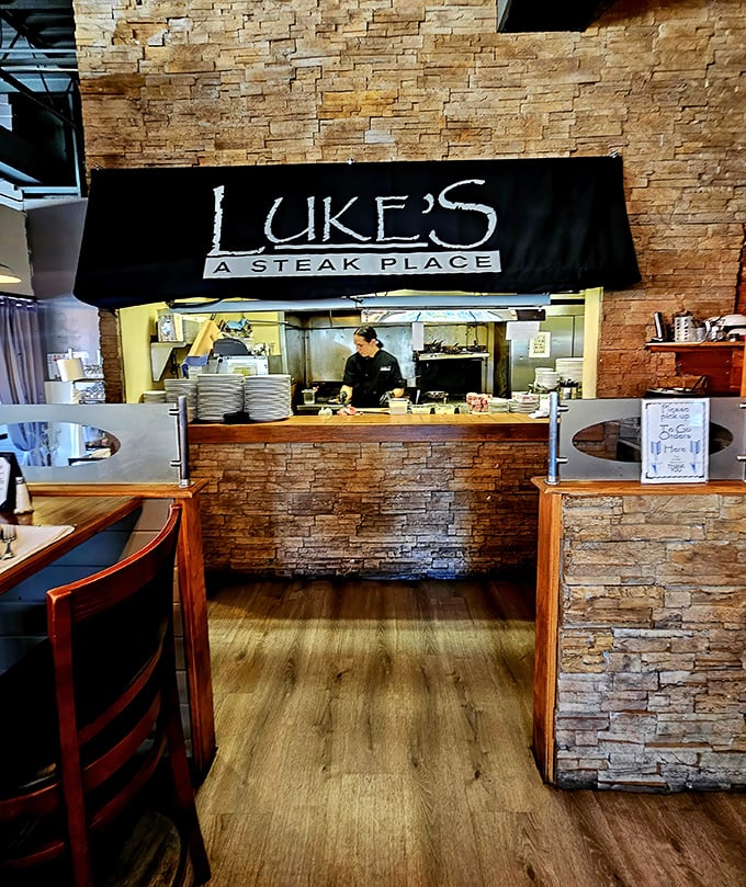 Where the magic happens&mdash;Luke's open kitchen gives diners a glimpse behind the culinary curtain. That stone wall isn't just decoration; it's a statement.