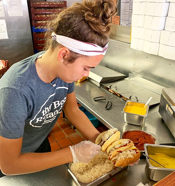 In the kitchen, where the magic happens. Those hands are crafting more than food—they're assembling memories that will last decades.