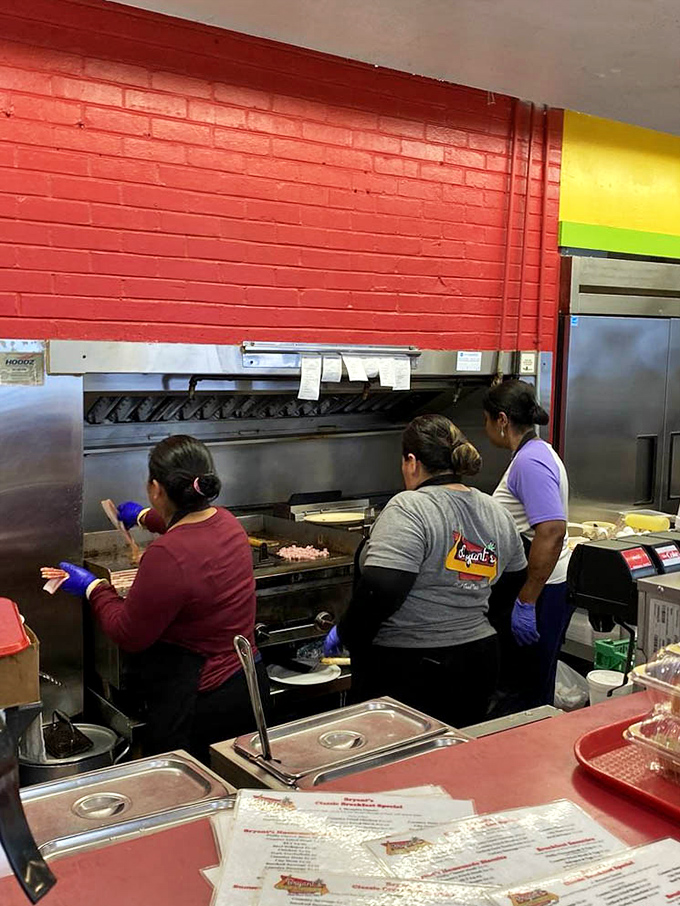 Behind the scenes magic where biscuit artisans work their craft. That red brick wall has witnessed countless breakfast miracles.