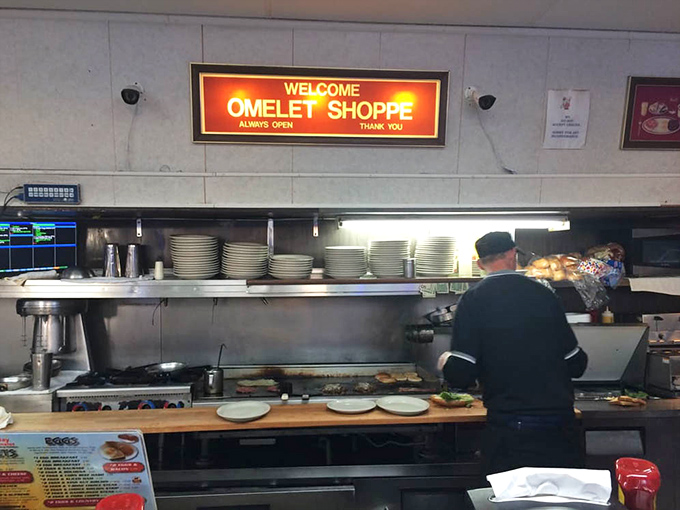"Welcome" glows above the kitchen pass – a promise kept with every plate that emerges from this well-orchestrated breakfast ballet.