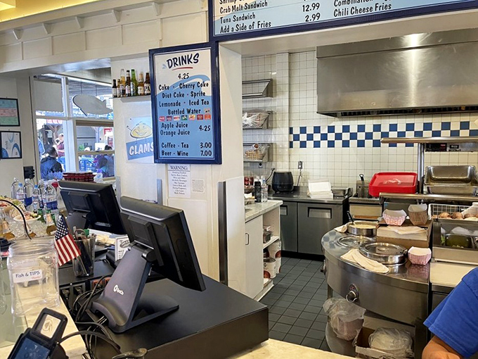 The kitchen's clean efficiency belies the magic happening behind the counter where seafood dreams are made real.
