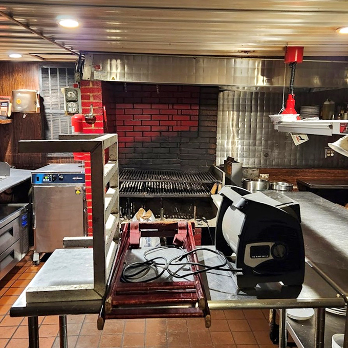 Behind the scenes, the grill stands ready like a medieval forge where beef is transformed into the stuff of dining legends.