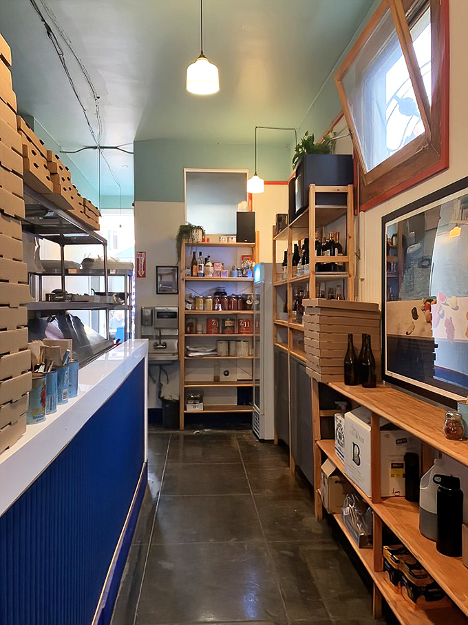 Behind the scenes magic happens in this efficiently designed space. Every shelf and surface has a purpose in pizza production.