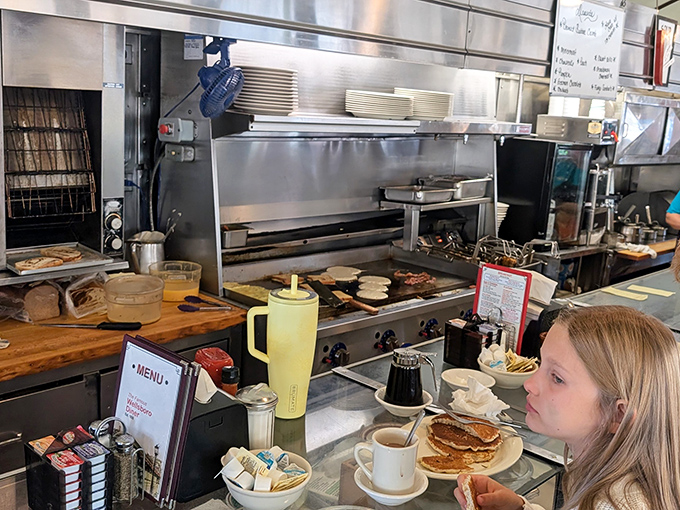 The beating heart of diner magic&mdash;where short-order cooks perform their breakfast ballet on a well-seasoned stage of stainless steel.