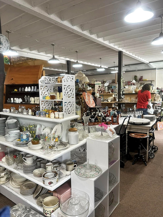 Dish paradise! White plates, patterned china, and glassware galore create a mismatched elegance that high-end designers try to replicate for ten times the price.