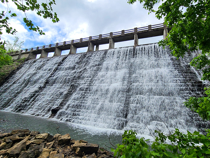The Lake Leatherwood Dam creates a mesmerizing waterfall, built by hand during the Depression and still showing off nearly a century later.
