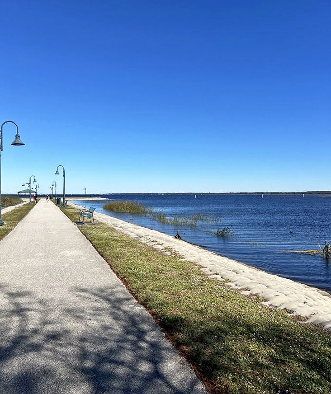 The lakefront walking path invites morning strollers and sunset seekers alike, with strategically placed benches for view appreciation.