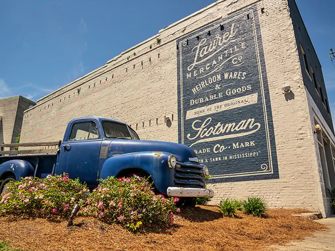 That vintage truck and ghost sign combo makes you nostalgic for decades you probably didn't even live through personally.