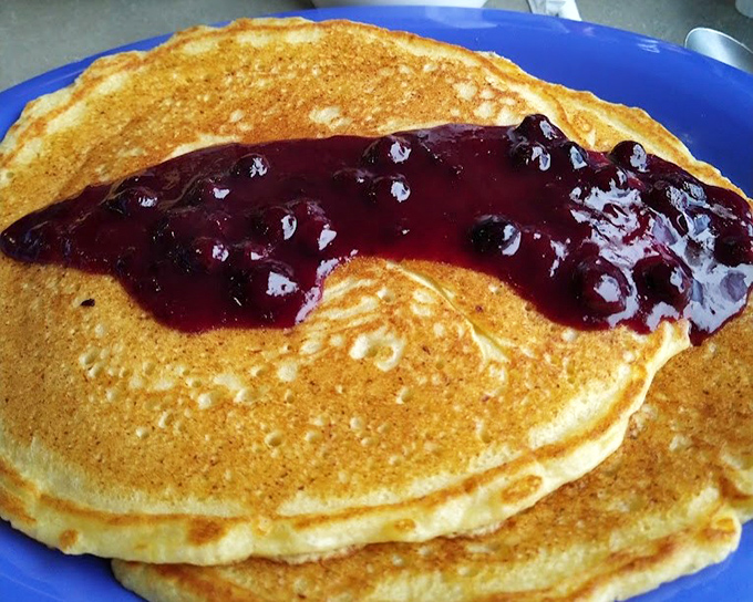 These pancakes with blueberry topping aren't just breakfast&mdash;they're edible sunshine that somehow tastes like childhood memories and weekend mornings. 