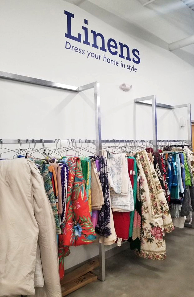 The linens section: where vintage tablecloths and quirky bedsheets tell stories of dinner parties and guest rooms from decades past.